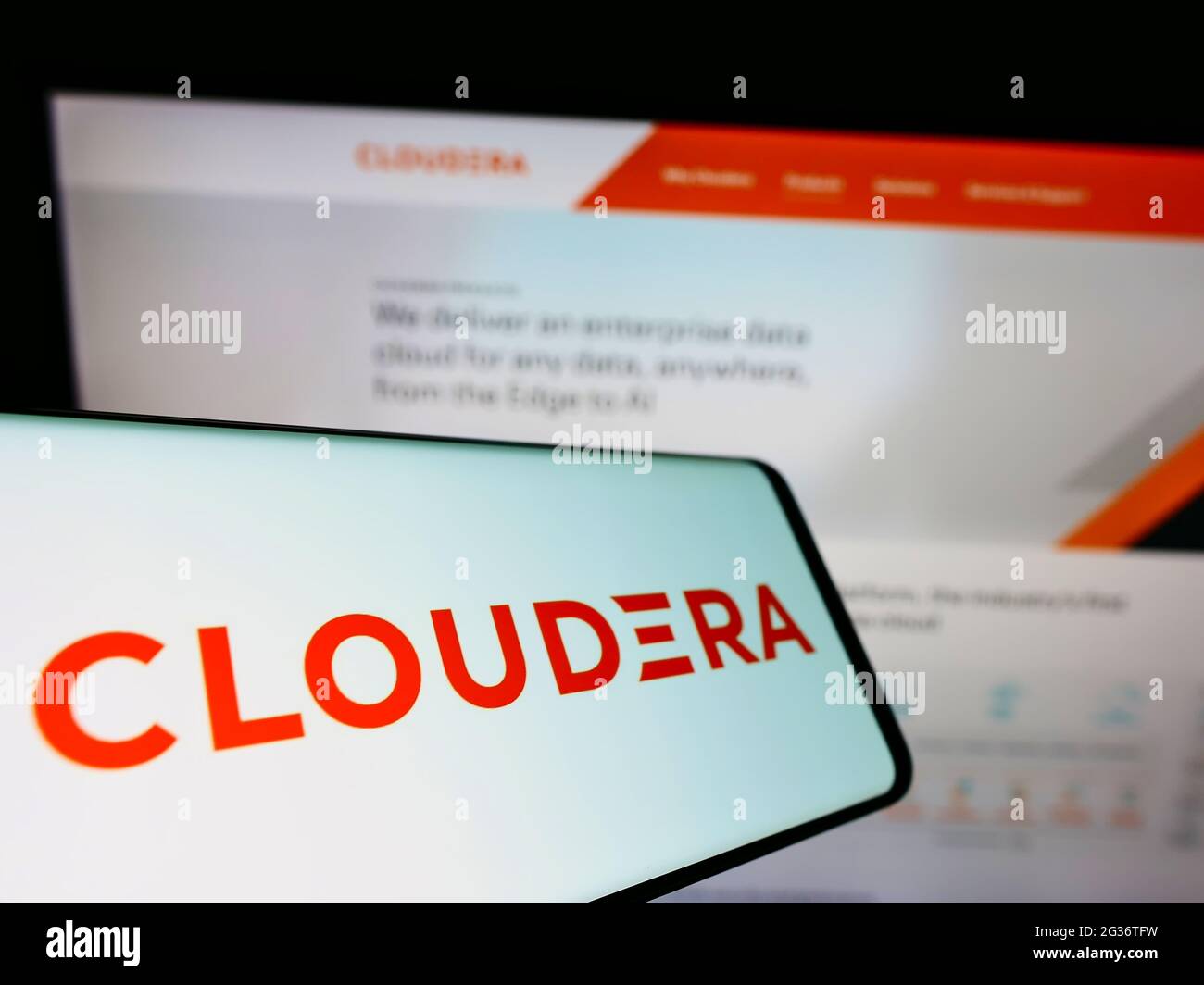 Mobile phone with logo of US software company Cloudera Inc. on screen ...