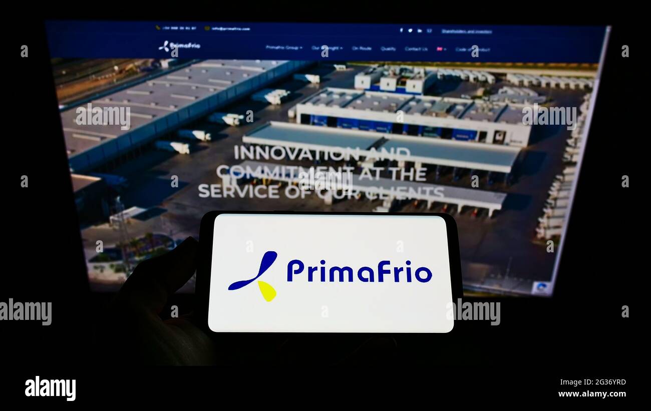 Person holding smartphone with logo of Spanish logistics company ...