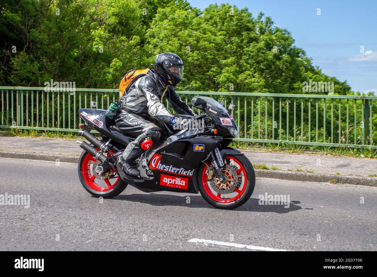1996 90s Aprilia black 249cc petrol motorcycle, Motorbike rider; two ...