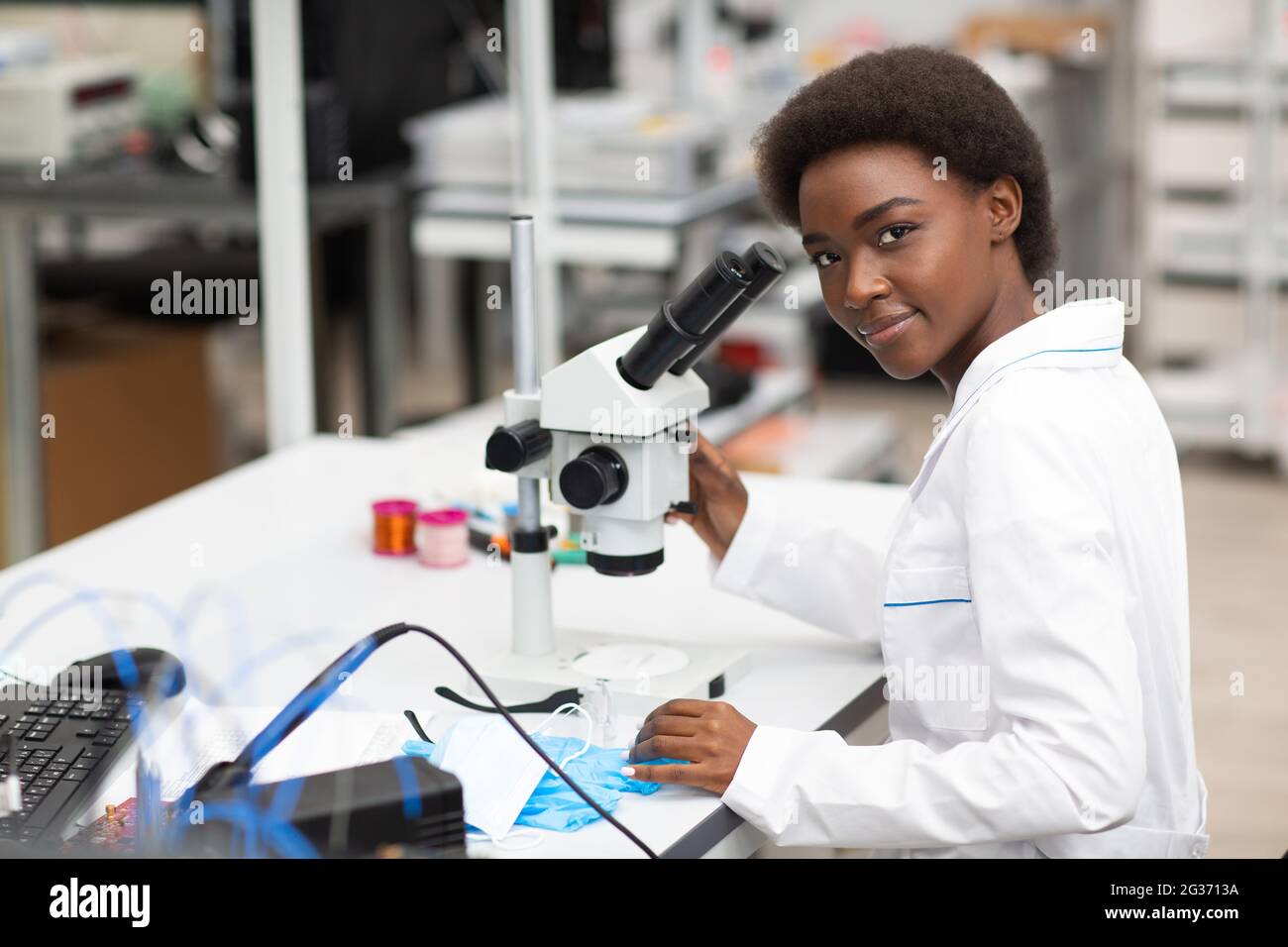 Scientist african american woman working in laboratory with electronic ...