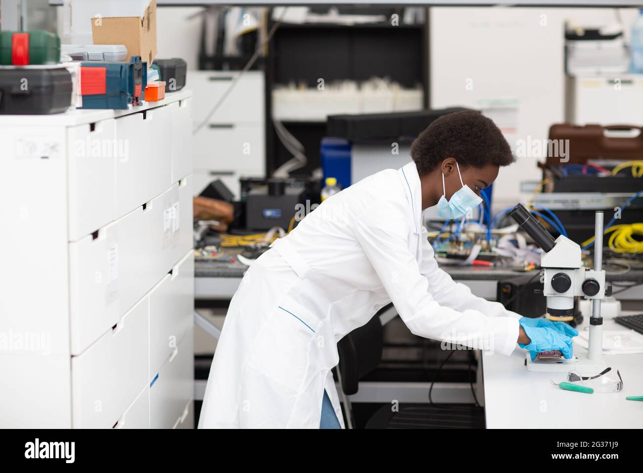 Scientist african american woman working in laboratory with instruments ...