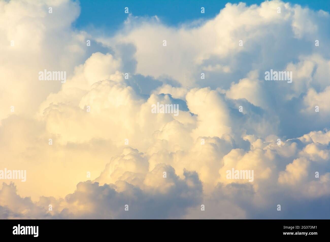 Huge cumulus clouds in the evening sky. Beautiful cloudscape Stock ...