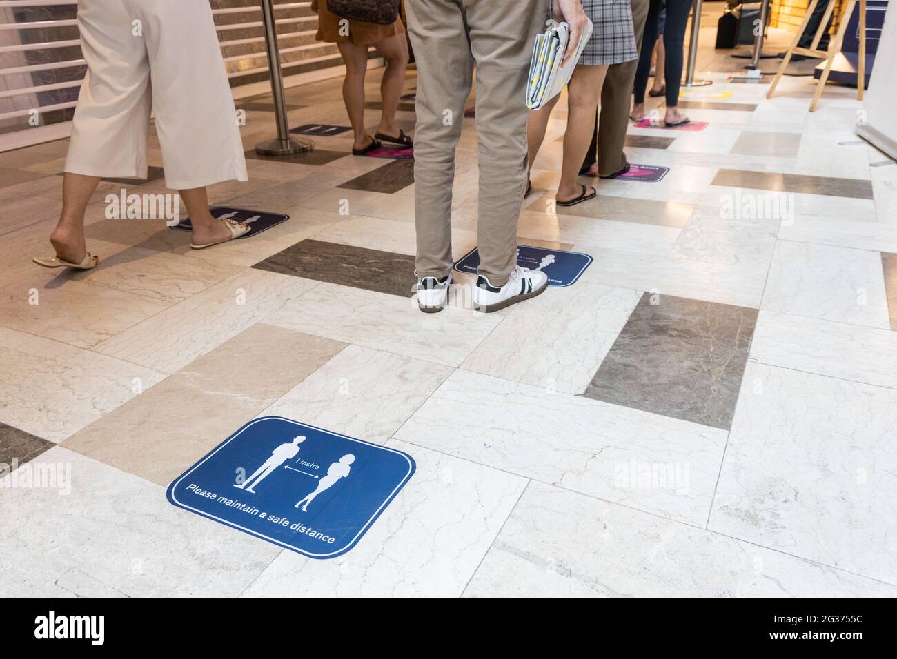 People queue in line for physical social distance to enter supermarket ...