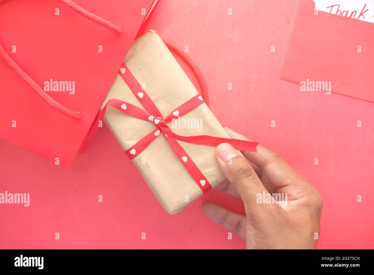 putting gift box in a shopping bag Stock Photo - Alamy