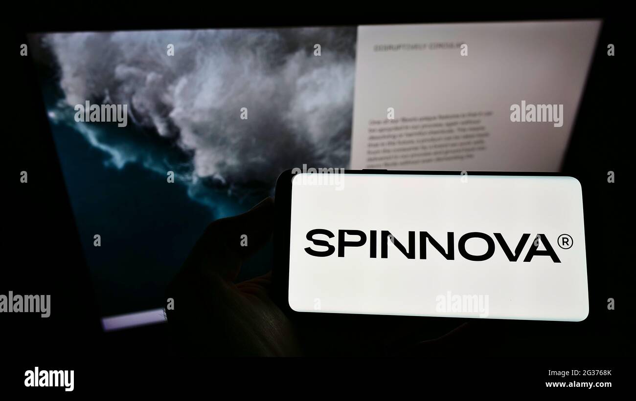 Person holding cellphone with logo of Finnish fiber textile company ...