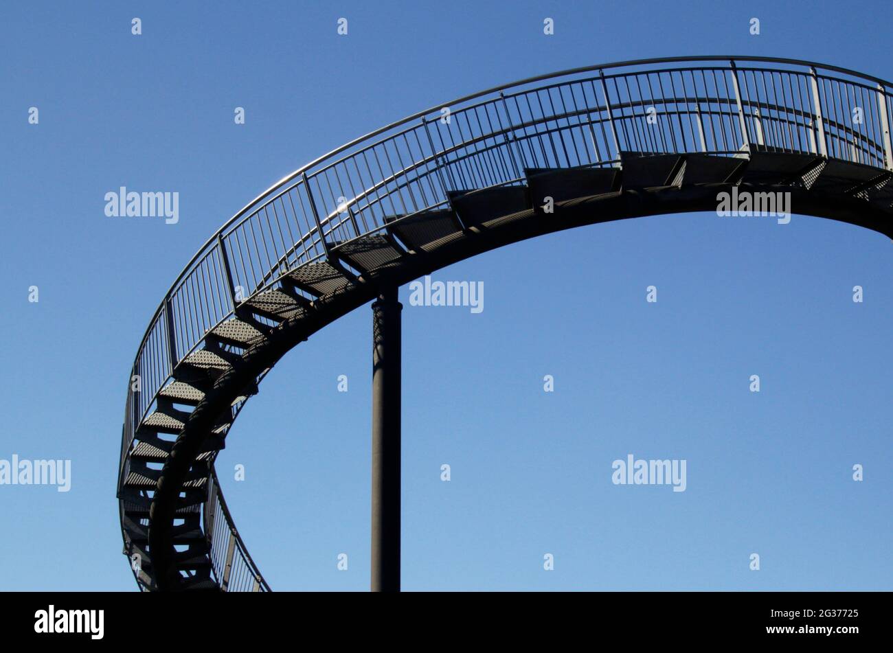 Steep metal stairs with curves Stock Photo - Alamy