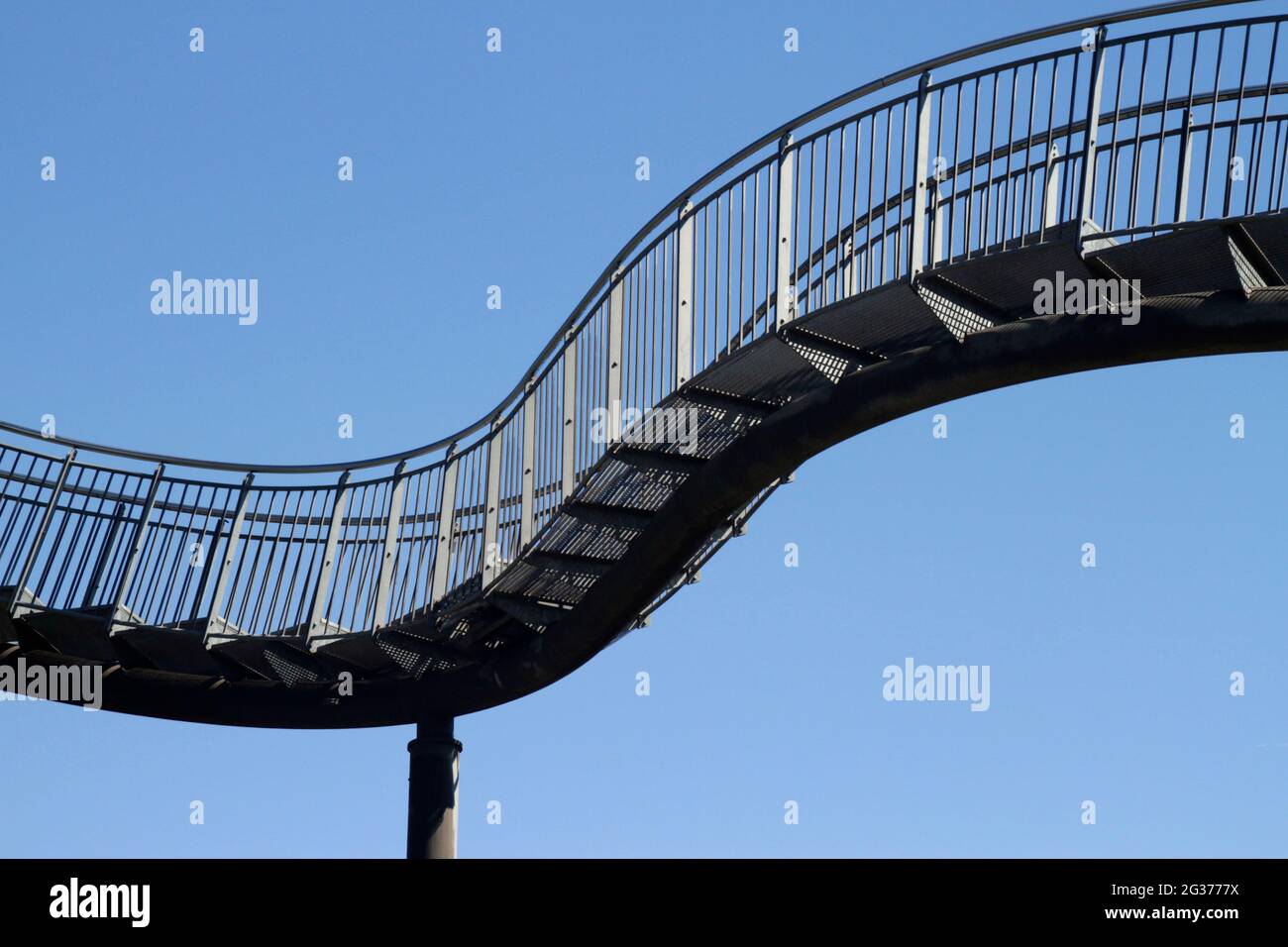 Steep metal stairs with curves Stock Photo - Alamy