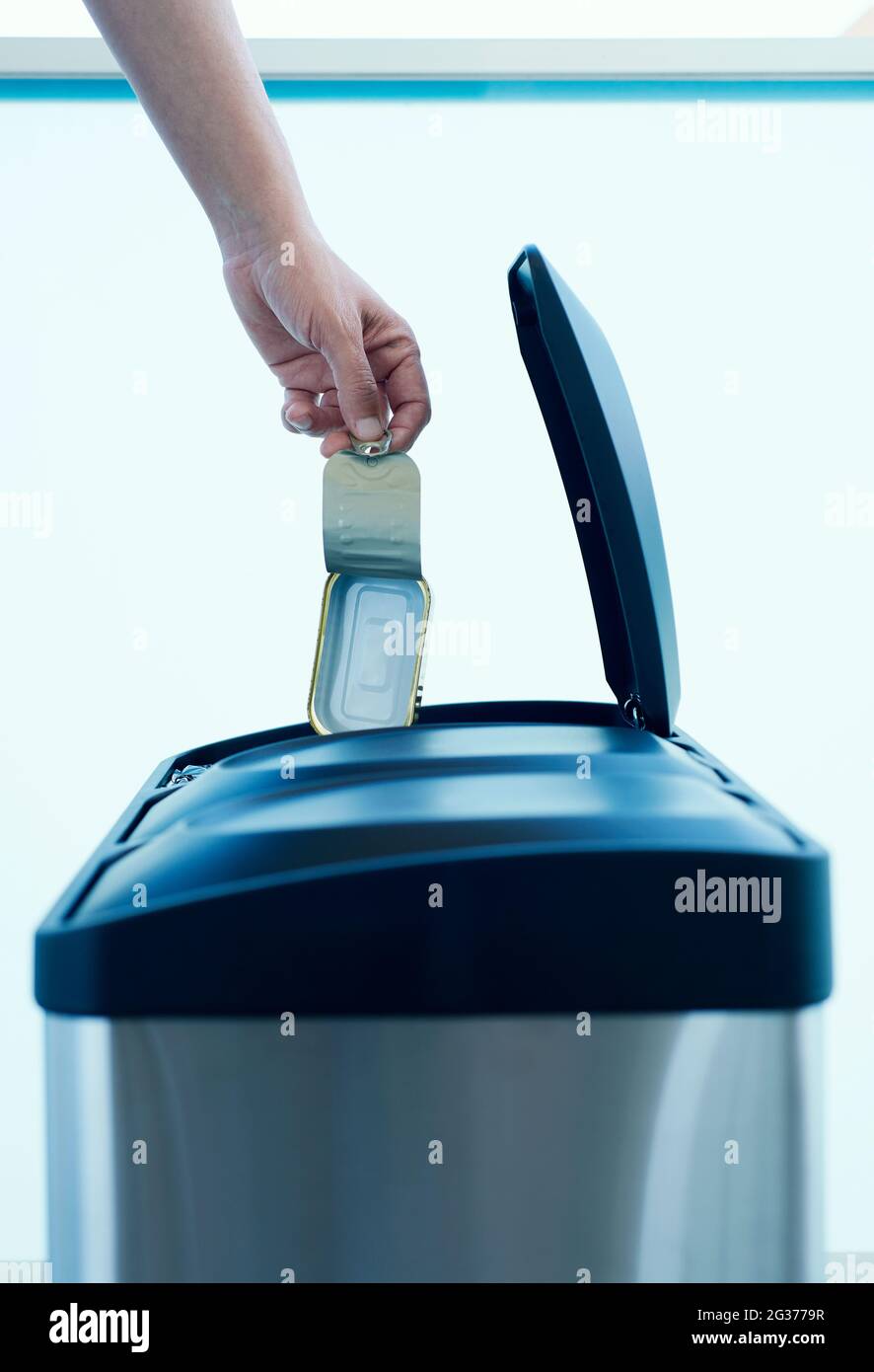 Man throwing rubbish in bin hi-res stock photography and images - Alamy