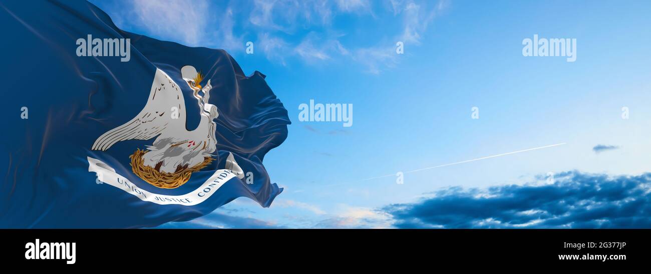 flag of Louisiana at cloudy sky background on sunset. Patriotic concept ...