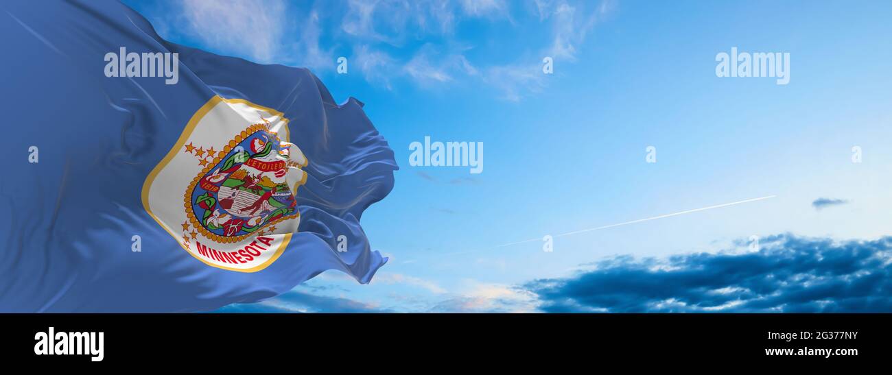 flag of Minnesota at cloudy sky background on sunset. Patriotic concept ...