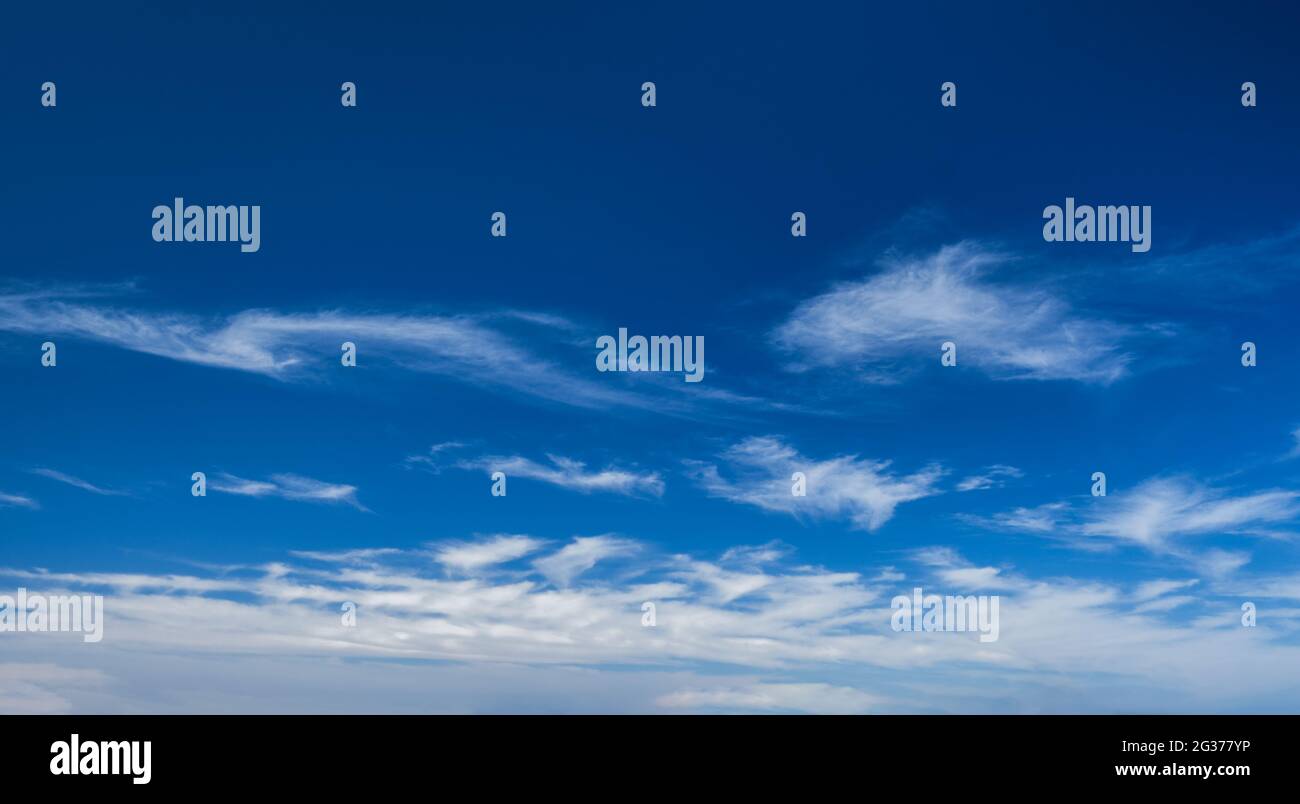 Blue clear sky with clouds Stock Photo - Alamy