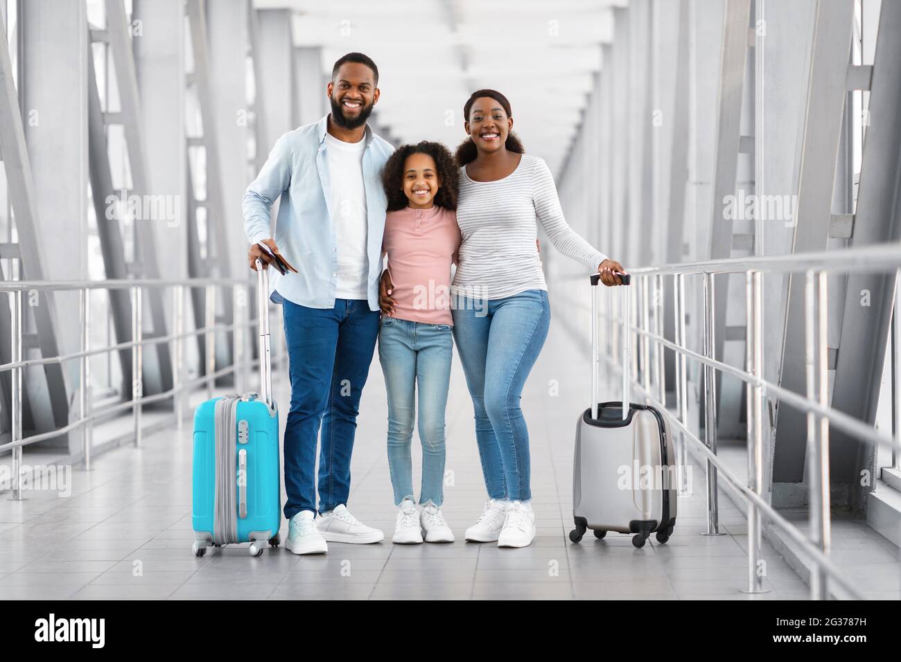 Black family traveling, posing together in airport Stock Photo - Alamy