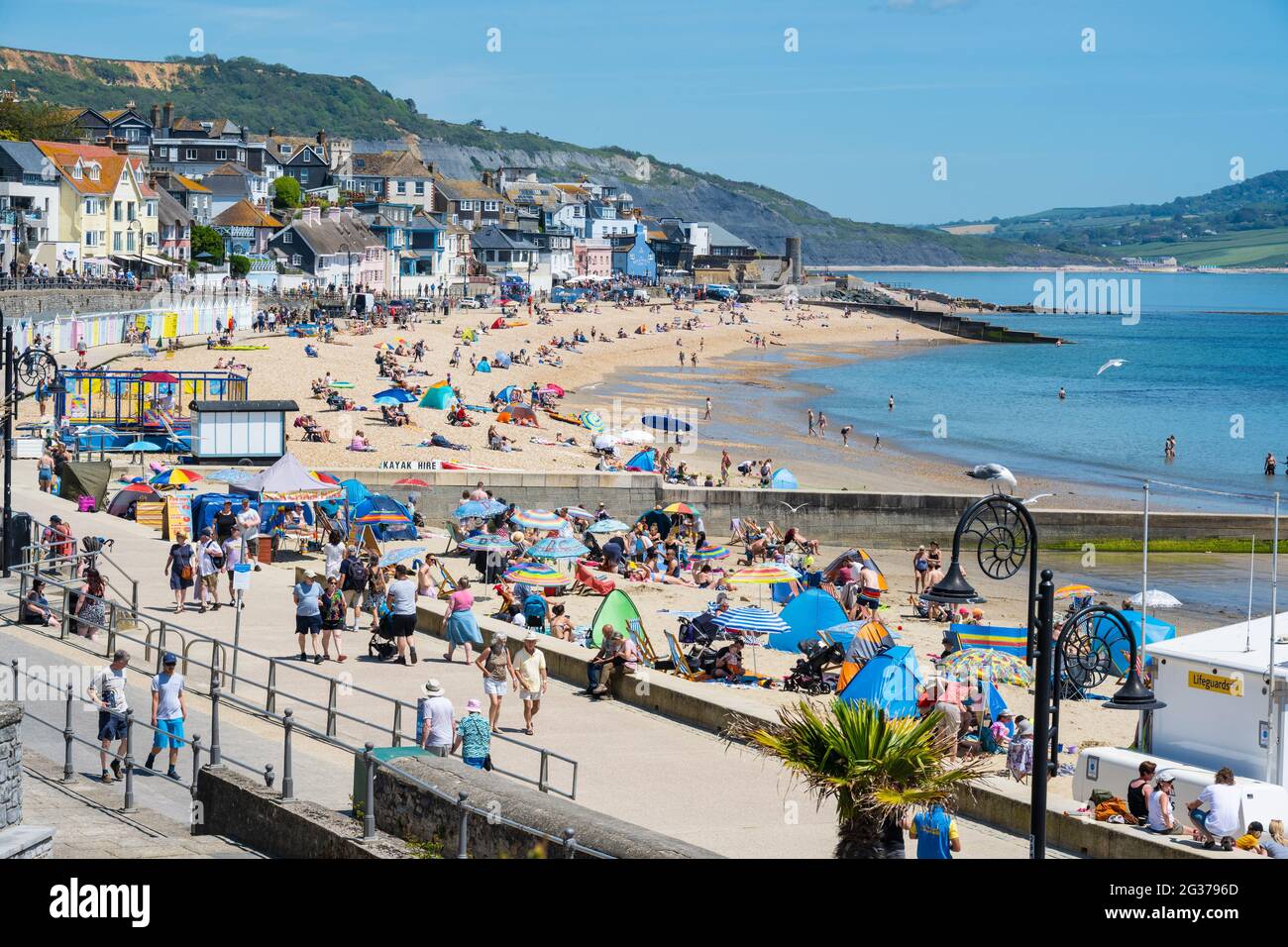 Lyme Regis, Dorset, UK. 14th June, 2021. UK Weather. Sun-seekers flock ...