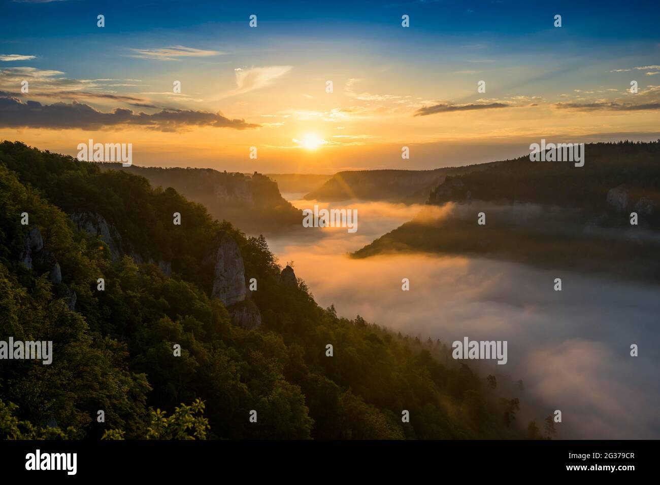 View from Eichfelsen to Werenwag Castle with morning fog, sunrise, near ... View from Eichfelsen to Werenwag Castle with morning fog, sunrise, near ...