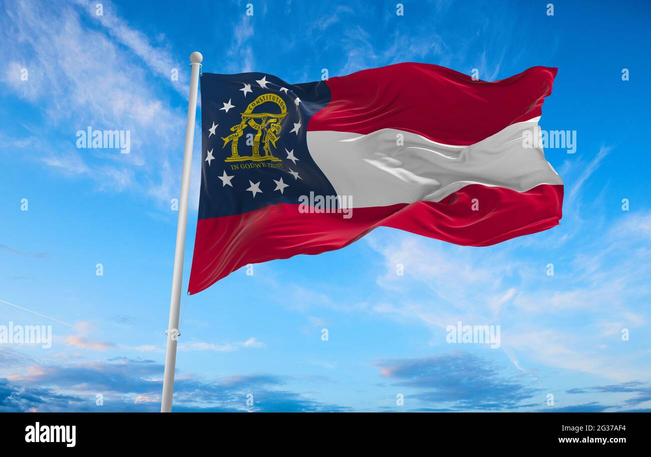 flag of Georgia at cloudy sky background on sunset. Patriotic concept ...