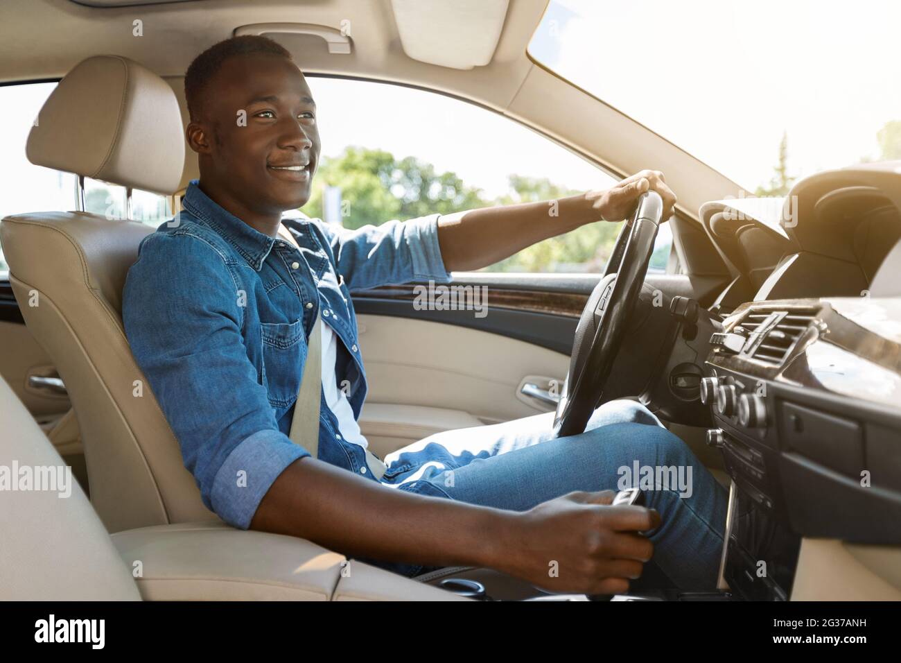 Black guy driving car hi-res stock photography and images - Alamy