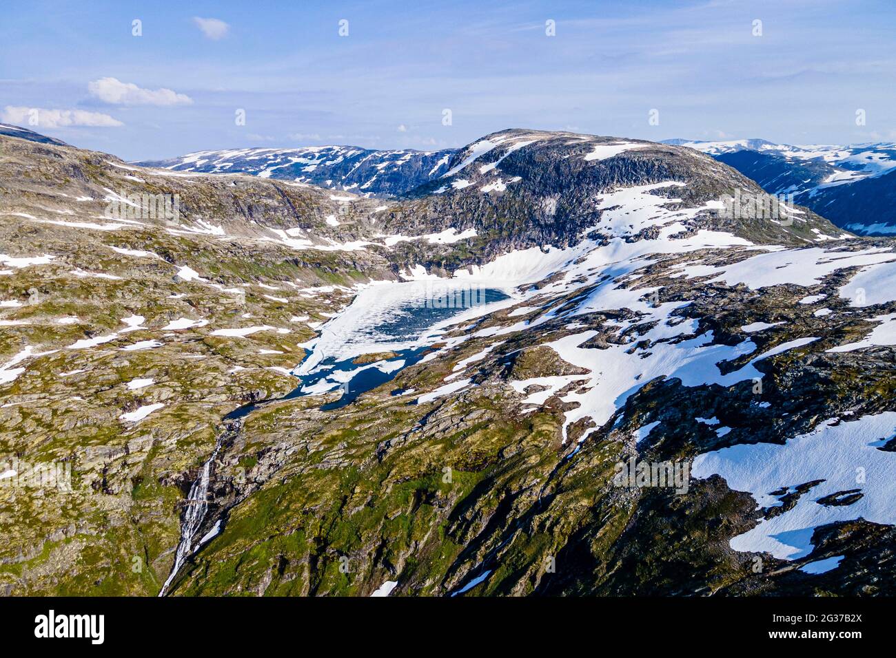 Aerial of a mountain lake in the mountains over Geirangerfjord, Sunmore ...