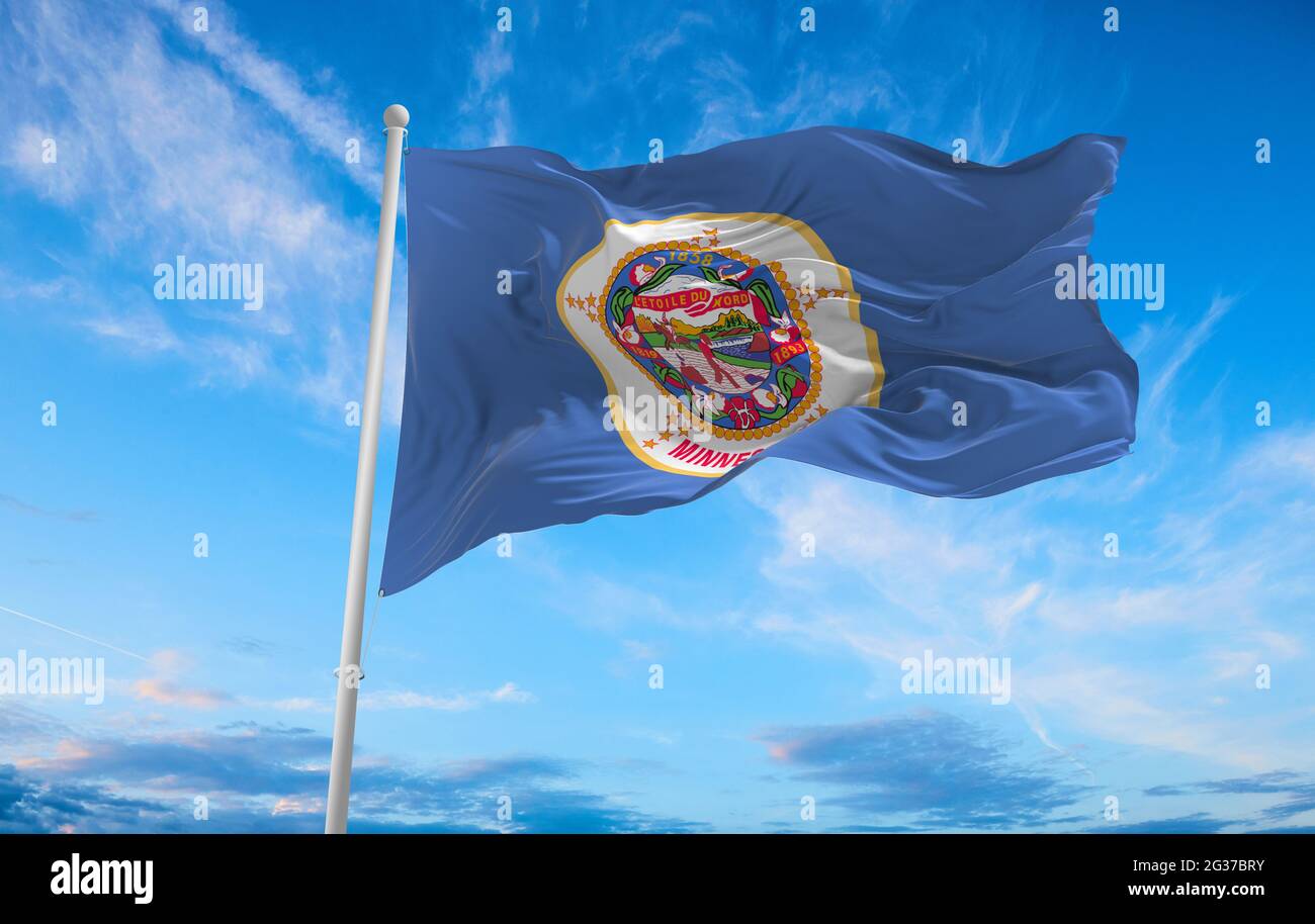 flag of Minnesota at cloudy sky background on sunset. Patriotic concept ...