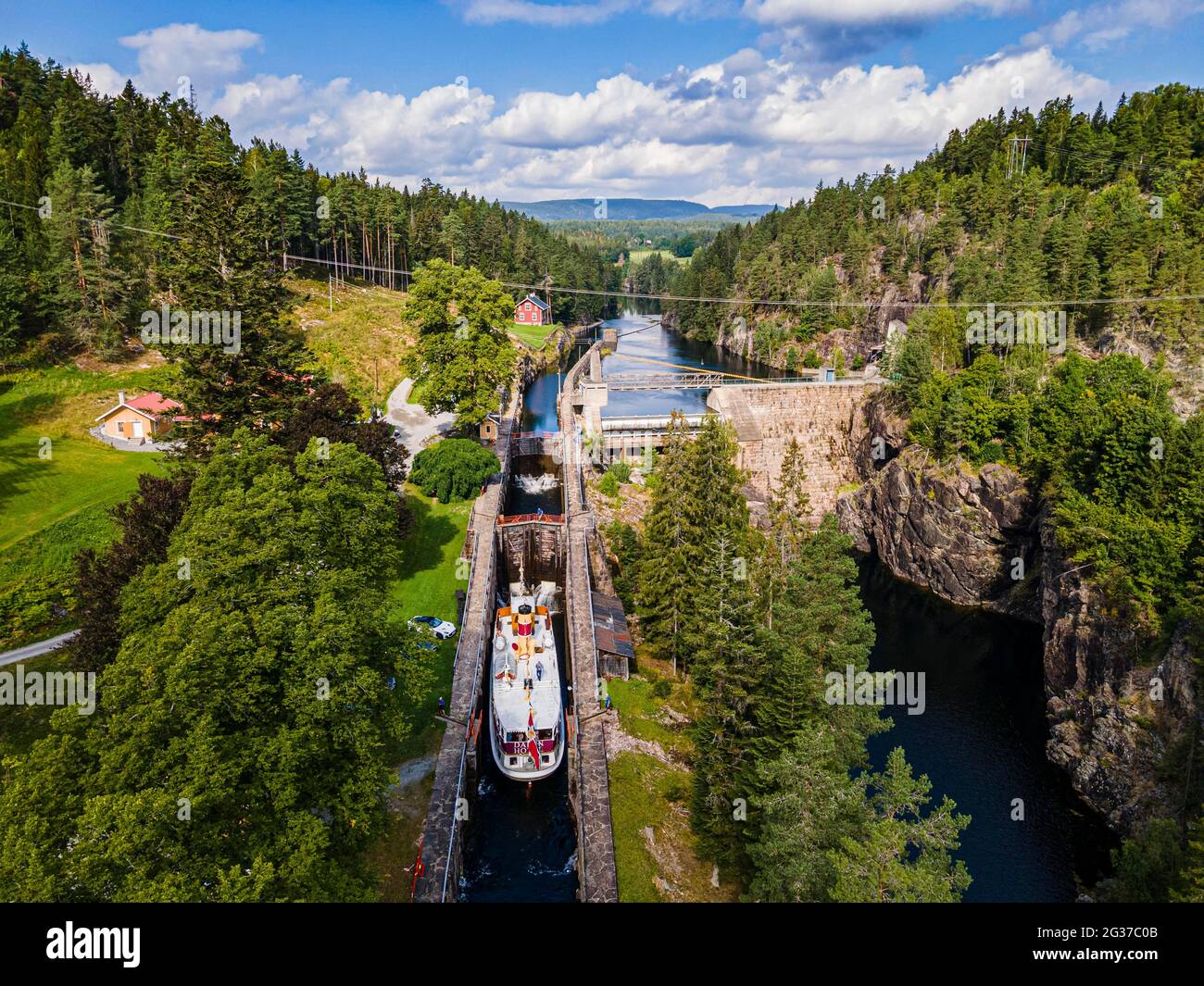 Aerial of a tourist boat in the Vrangfoss lock, Telemark Canal, Norway ...