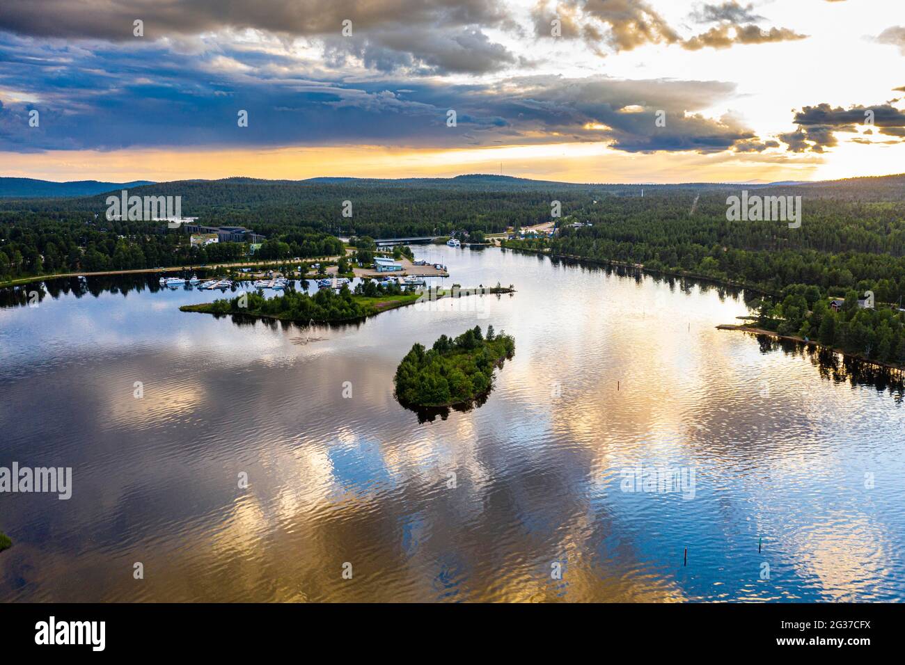 Clouds reflecting at sunset on Lake Inari, Inari, Lapland, northern ...