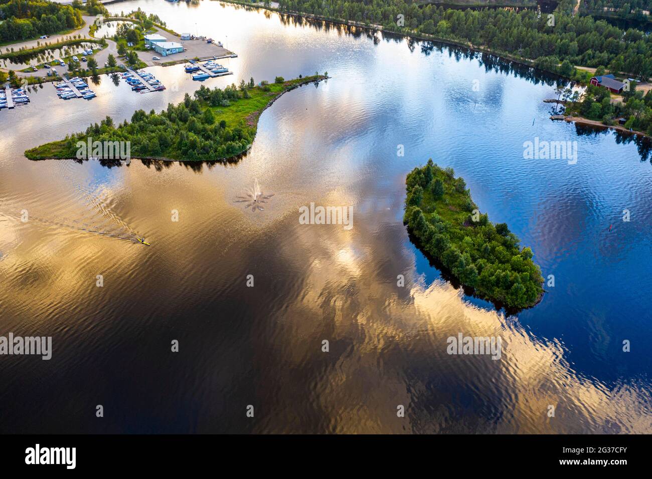 Man rowing a cayak at sunset, Lake Inari, Inari, northern Finland Stock ...