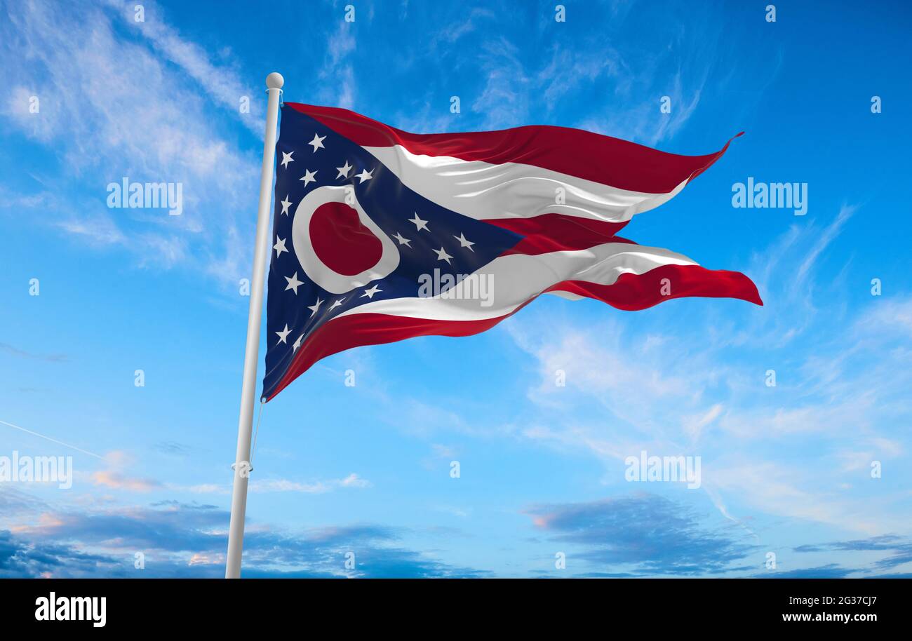 flag of Ohio at cloudy sky background on sunset. Patriotic concept ...