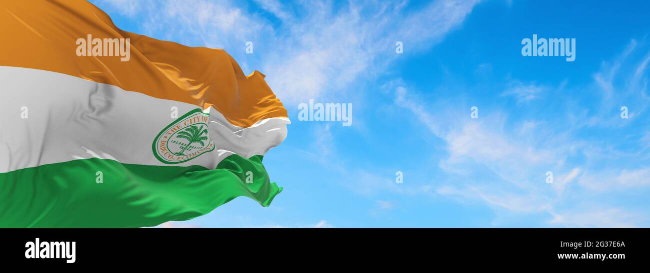 flag of Miami, Florida at cloudy sky background on sunset, panoramic ...