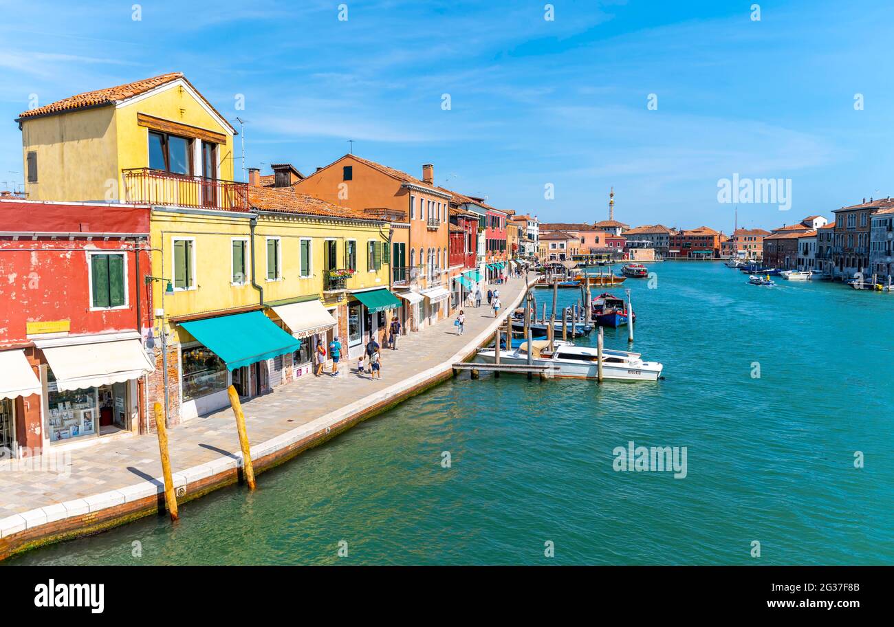 Colorful houses and boats on a canal of Murano, Murano Island, Venice ...