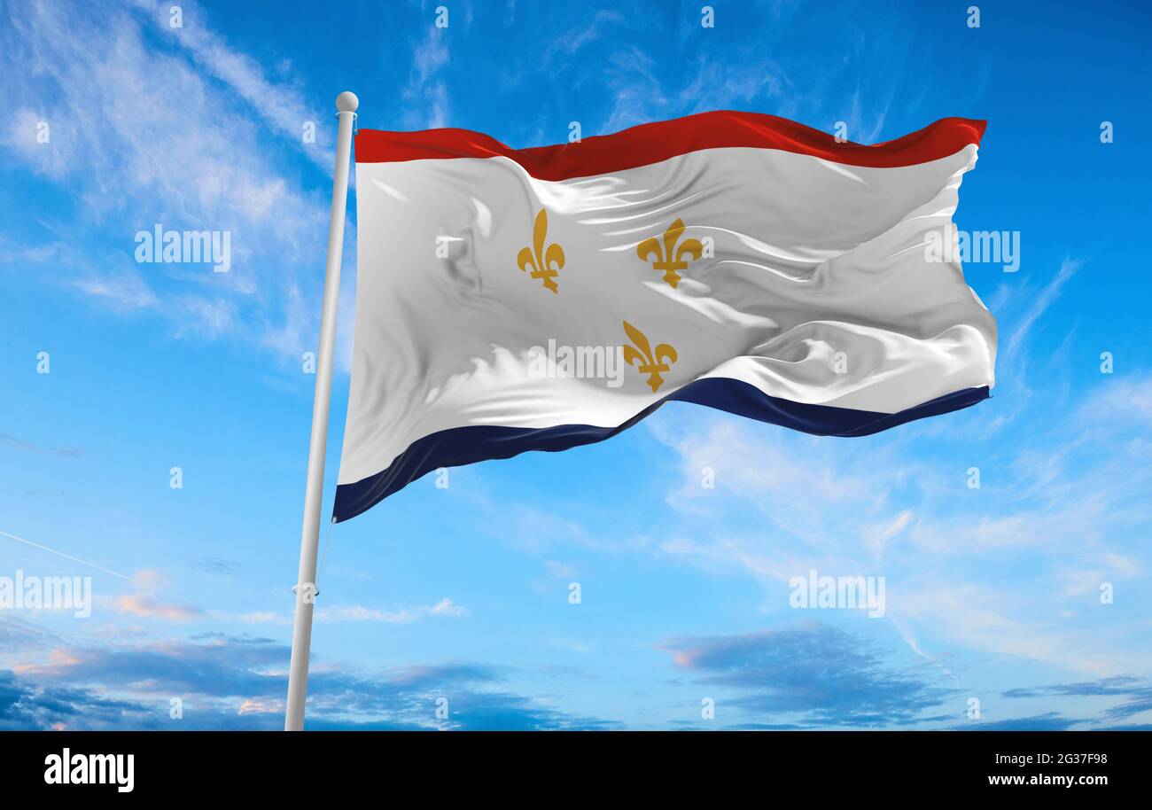 flag of New Orleans, Louisiana at cloudy sky background on sunset ...