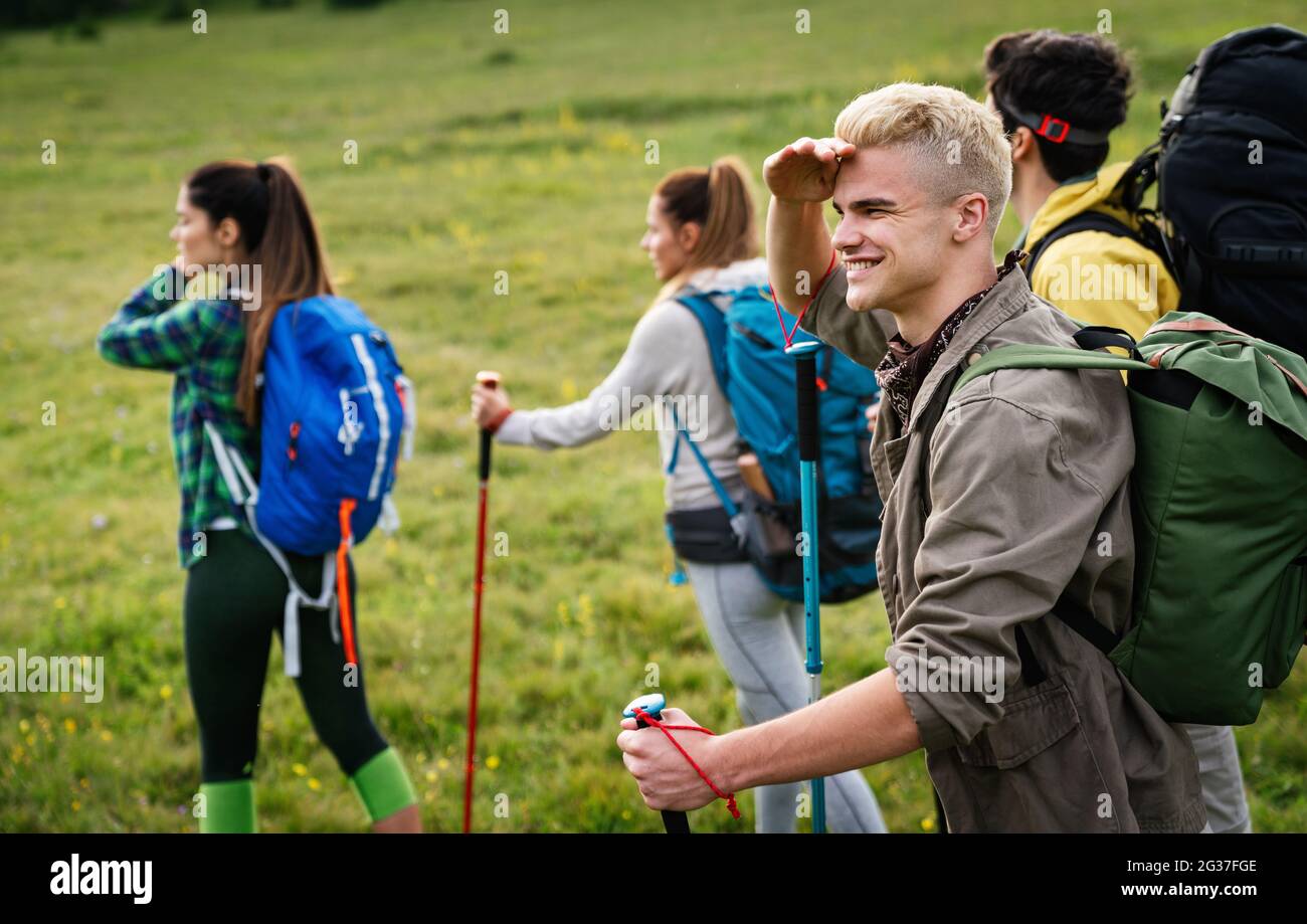 Trekking, hiking, camping and wild life concept. Group of friends ...