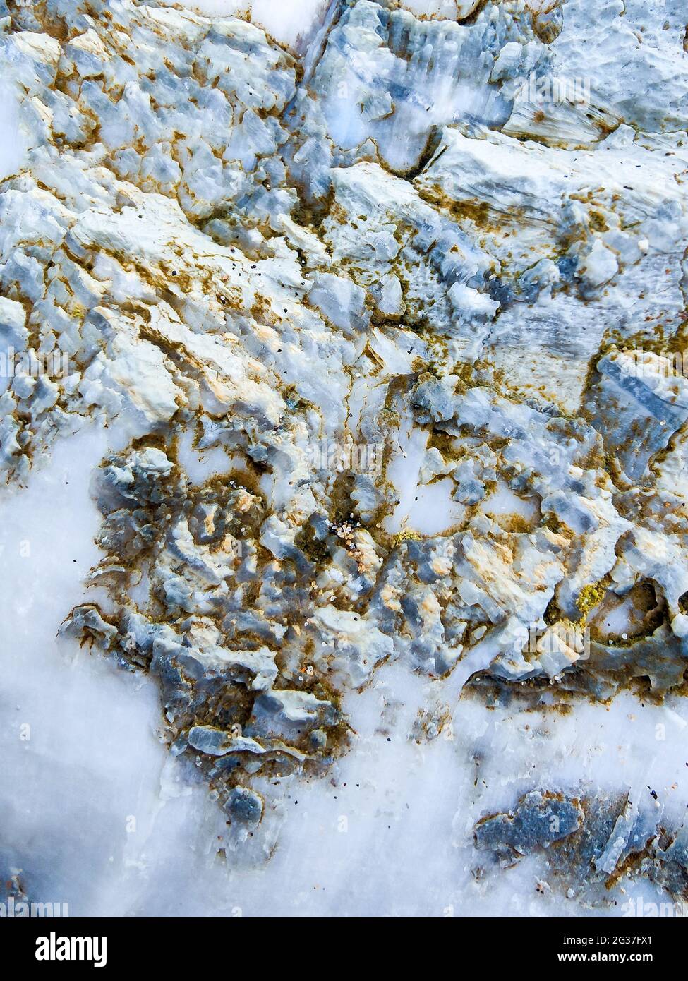 Rough texture of a piece of geological white rock on Sopelana beach ...