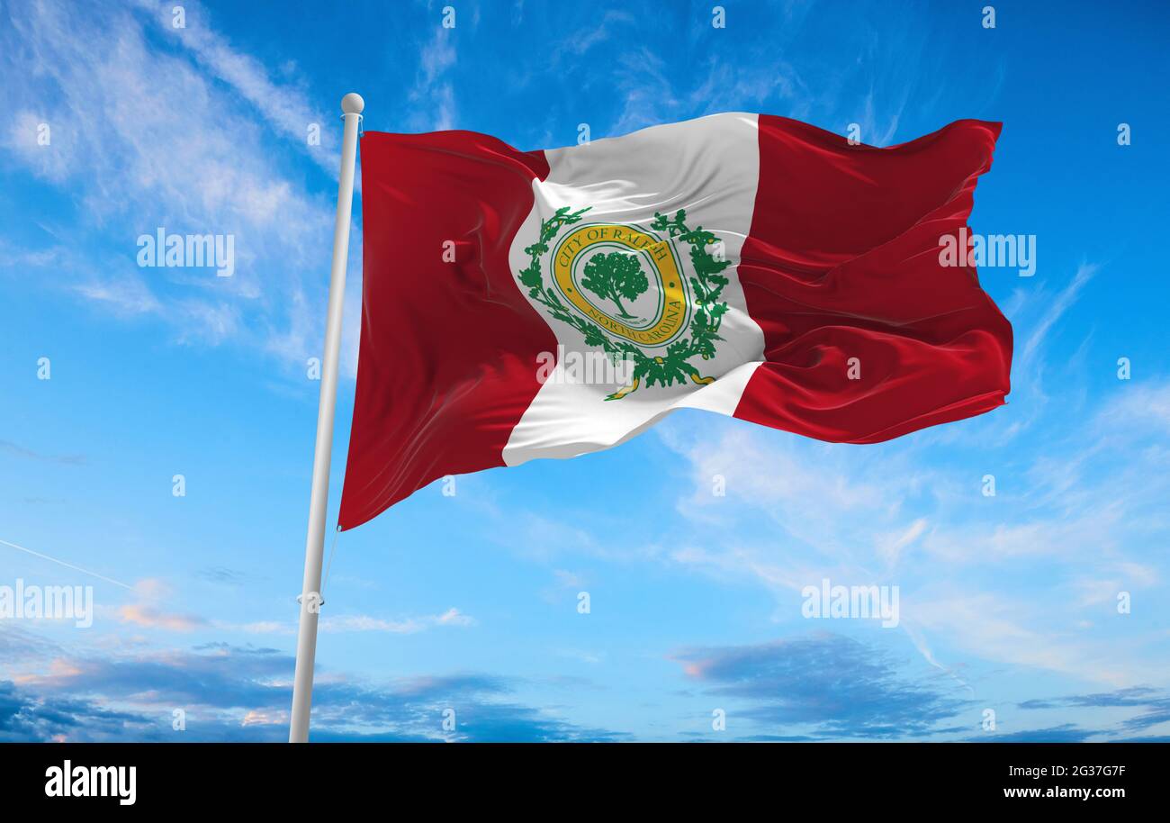flag of Raleigh, North Carolina at cloudy sky background on sunset ...