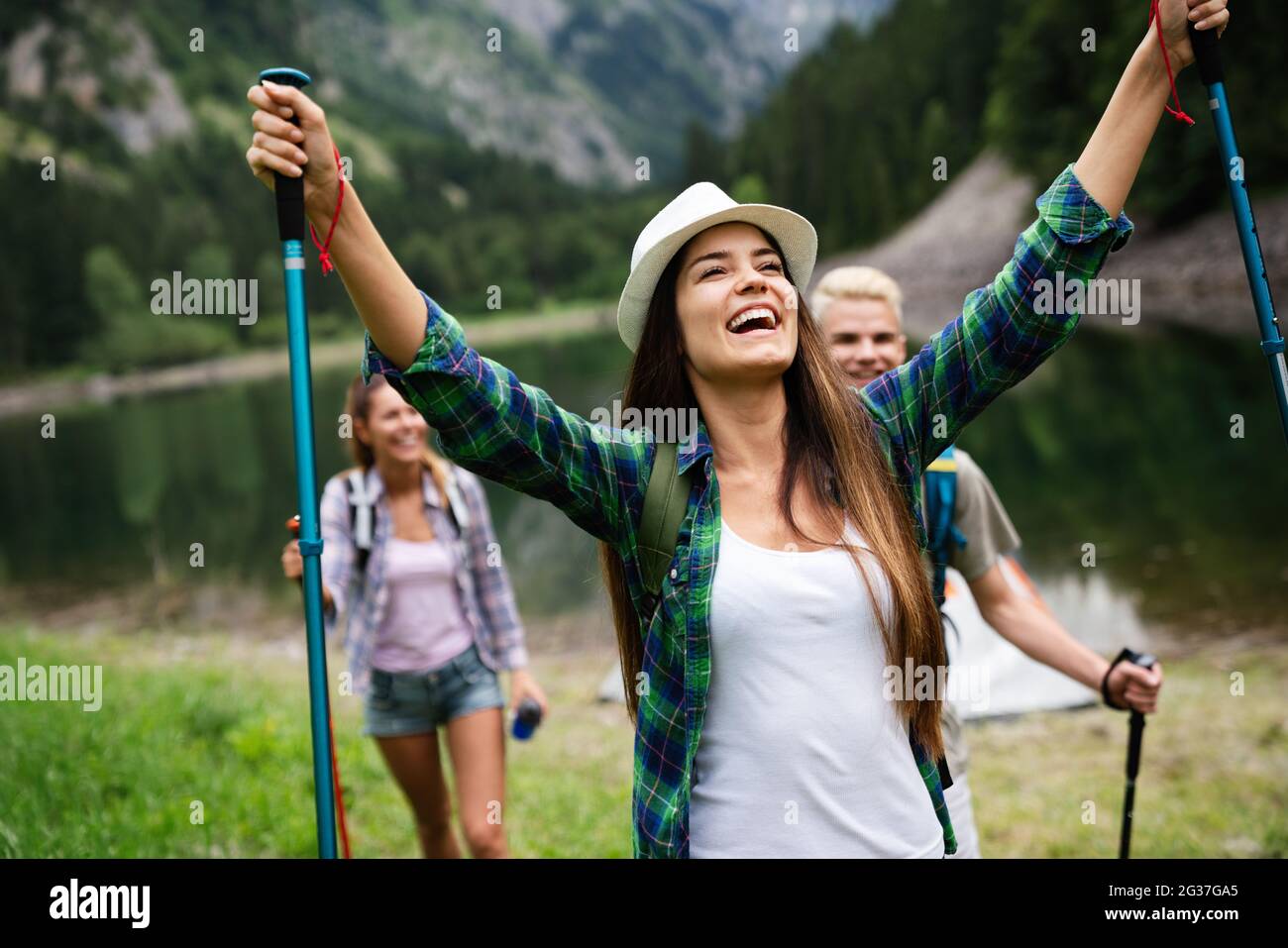 Group of happy hiker friends trekking as part of healthy lifestyle ...