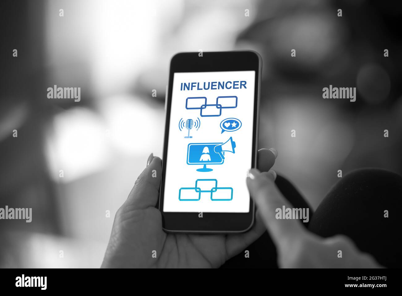 Hand holding a smartphone with influencer concept Stock Photo - Alamy