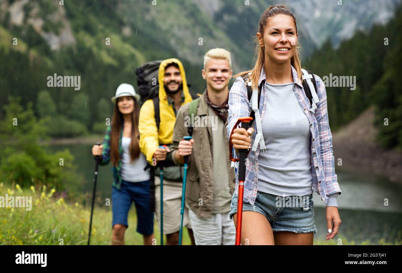 Group of happy friends enjoying outdoor activity together Stock Photo ...