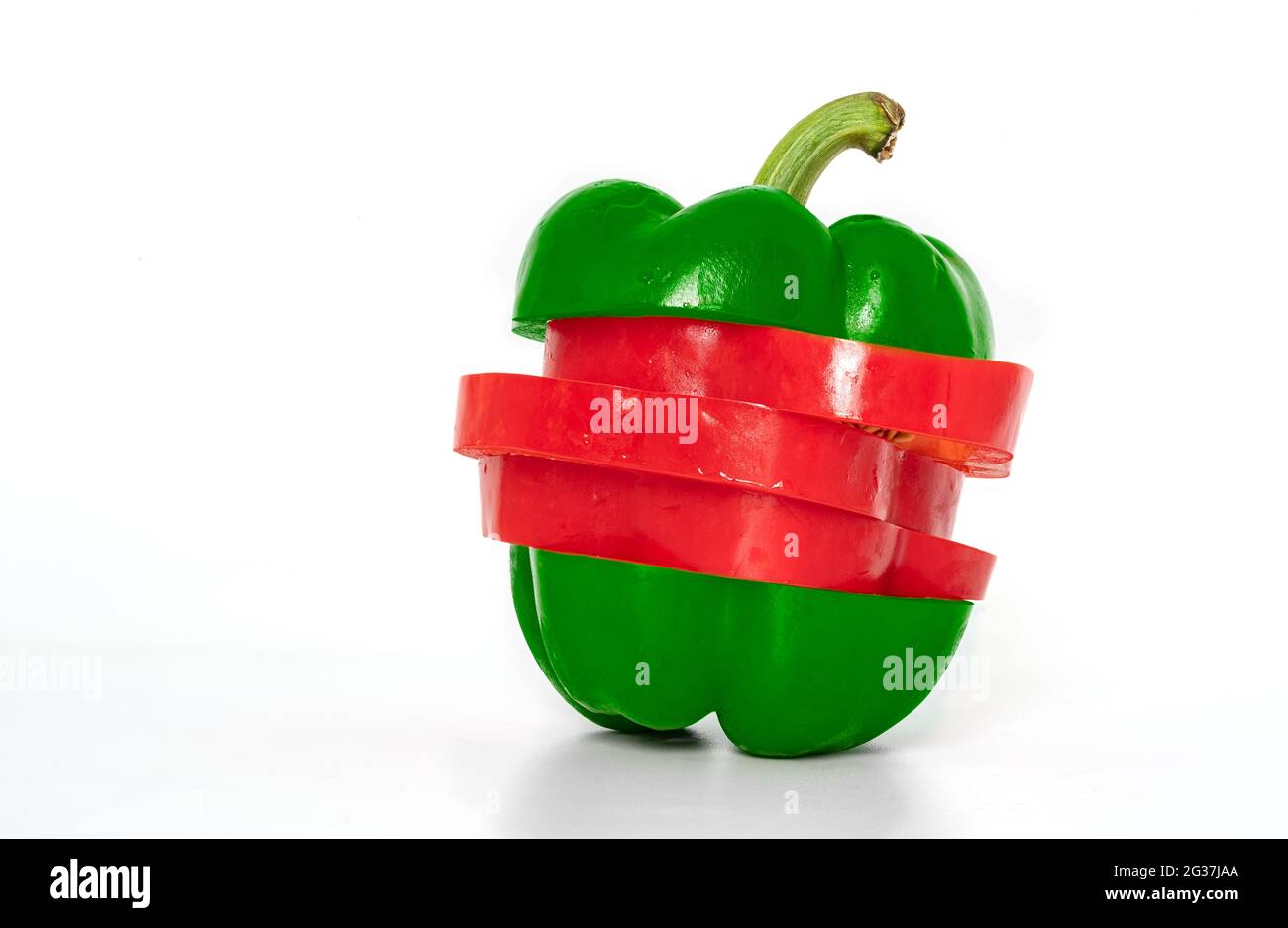 Sliced wet red and green pepper or Bell pepper on white background ...