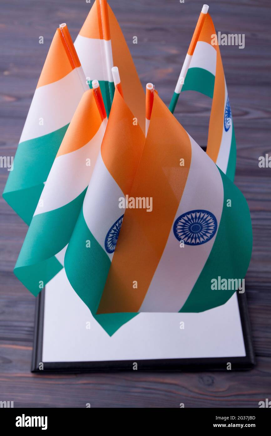Vertical shot collection of indian flags on grey wood background Stock ...