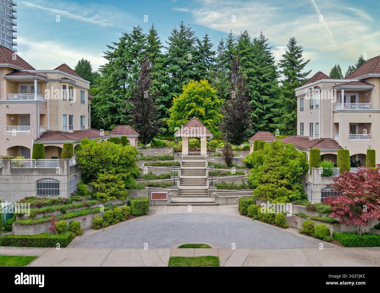 Italian style low-rise residential building with concrete stairs to ...