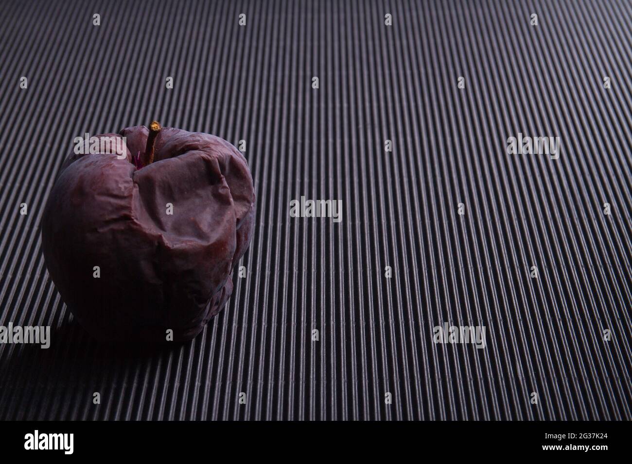Decomposition of an apple on dark background with copy space Stock ...