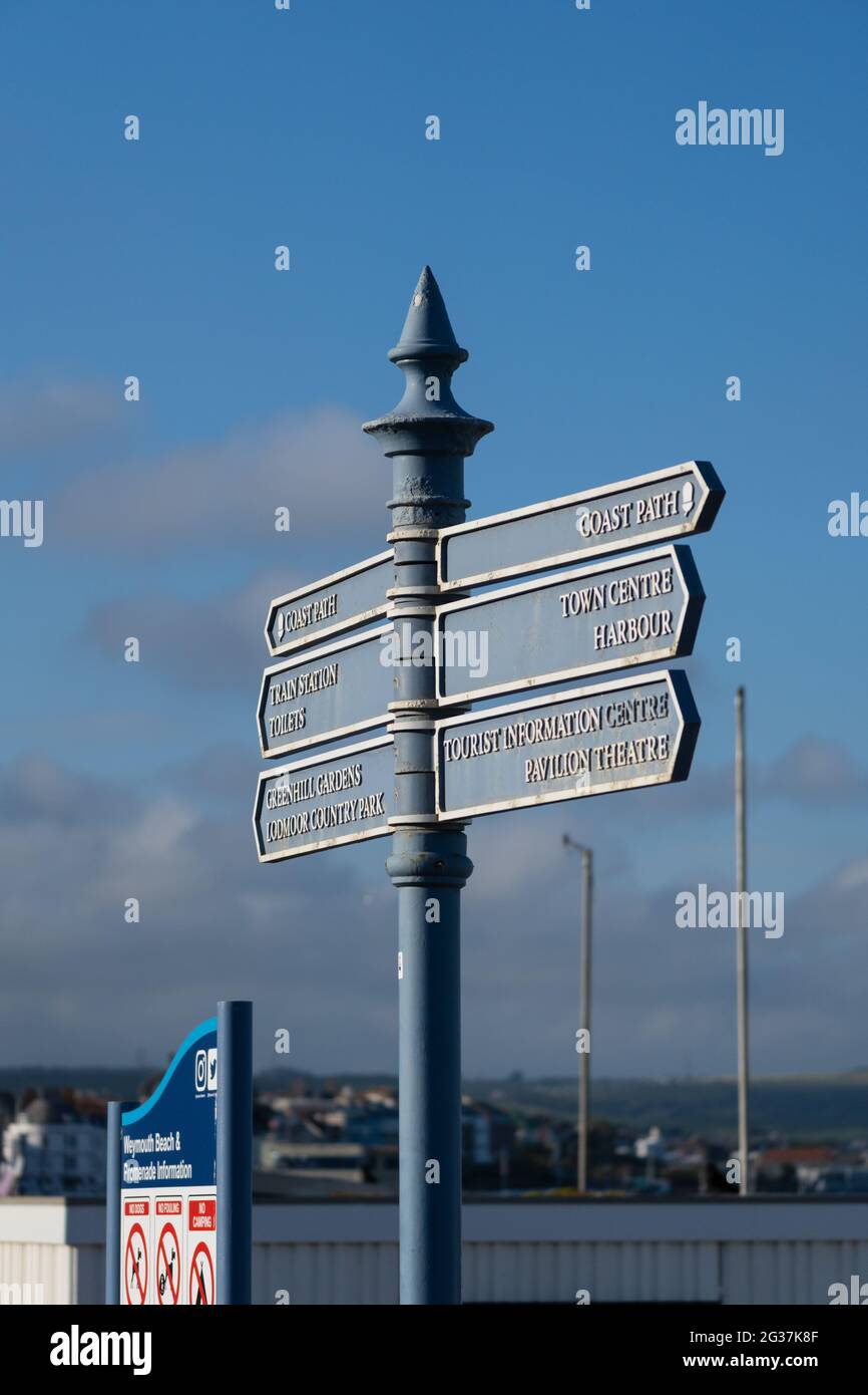 Sign post on Weymouth Beach Stock Photo - Alamy