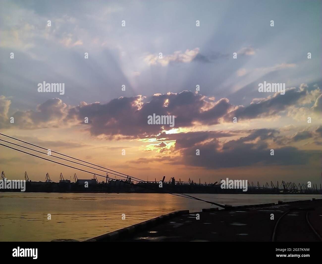 sunset in the port Stock Photo - Alamy
