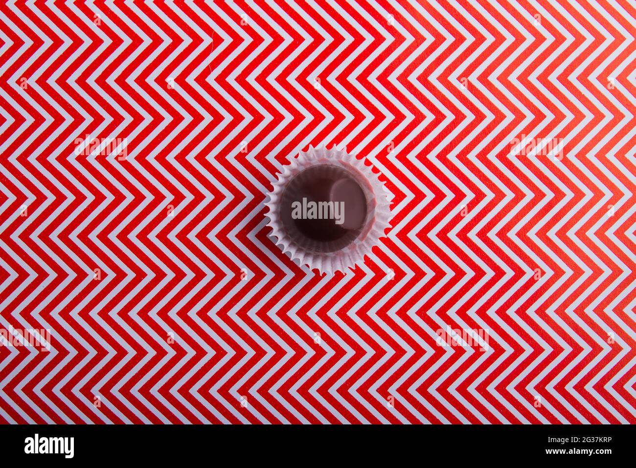 Top view one single round milk chocolate candy Stock Photo - Alamy