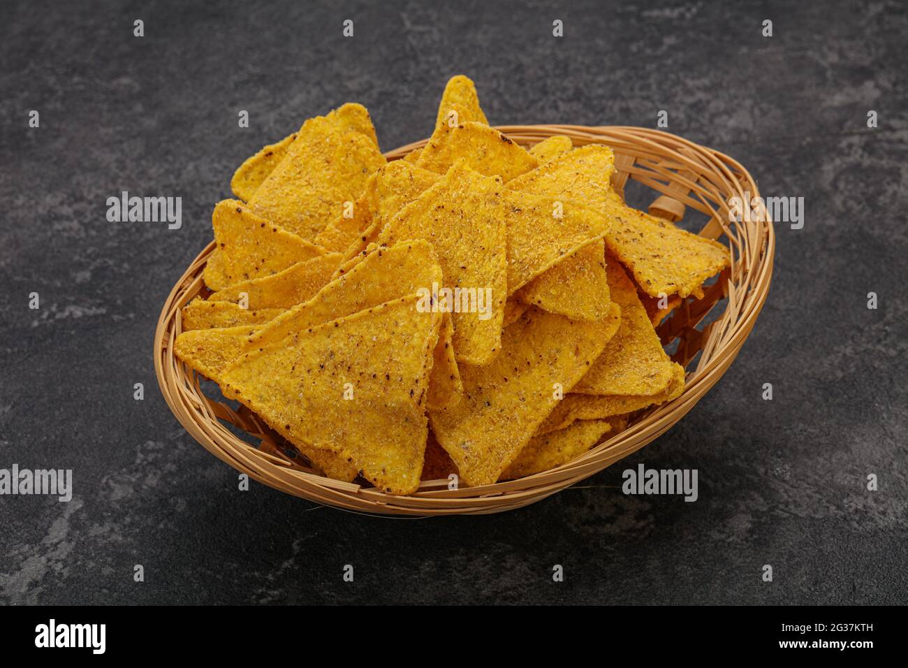 Mexican crunchy corn nachos triangle heap Stock Photo - Alamy