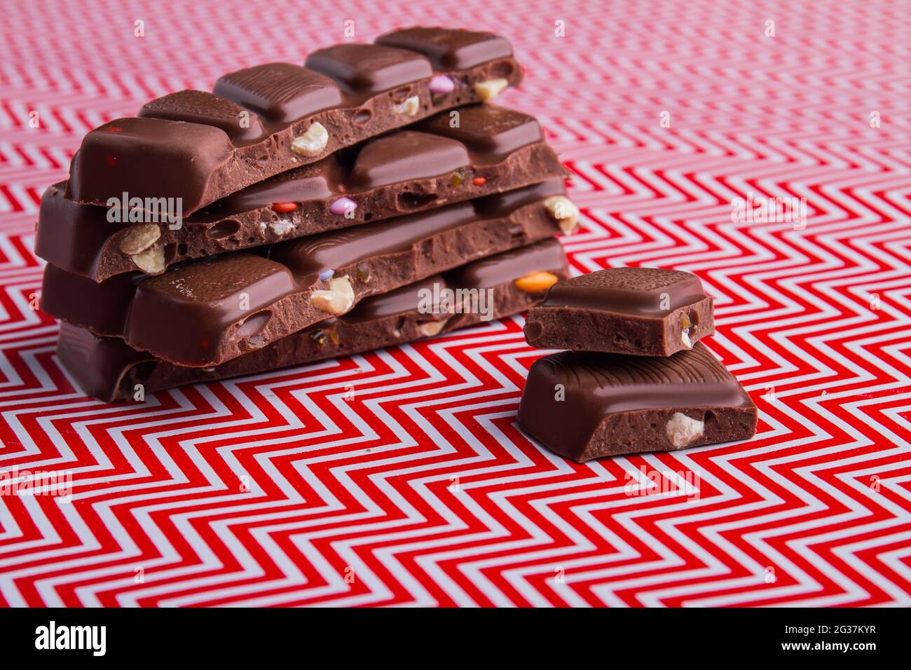 Stacks of chocolate bar pieces with various nuts Stock Photo - Alamy