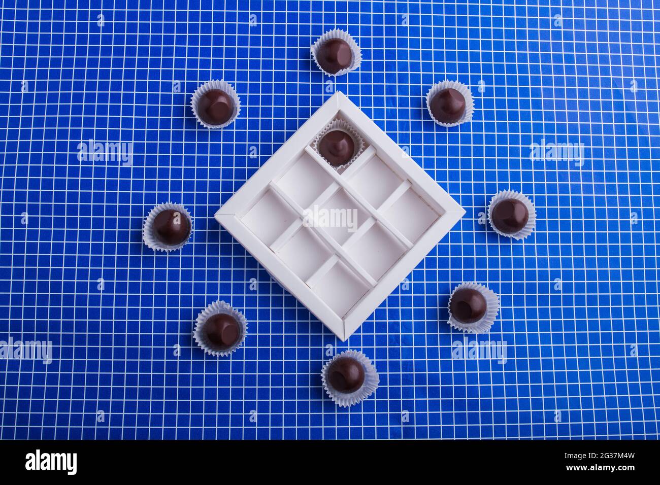 Flat lay sweet chocolate candies around the box Stock Photo - Alamy
