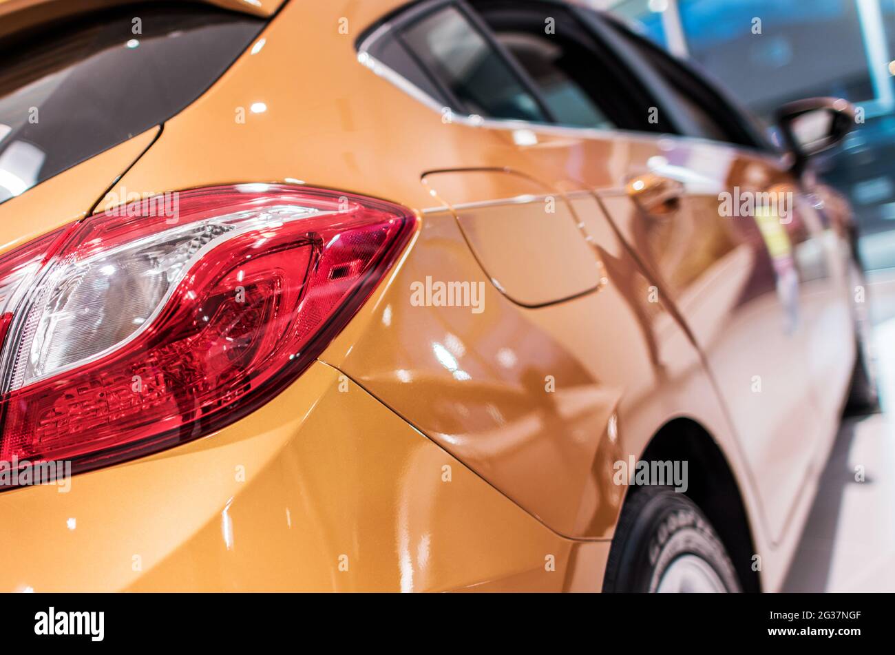 Brand New Orange Copper Body Colour Car in Dealership Showroom ...
