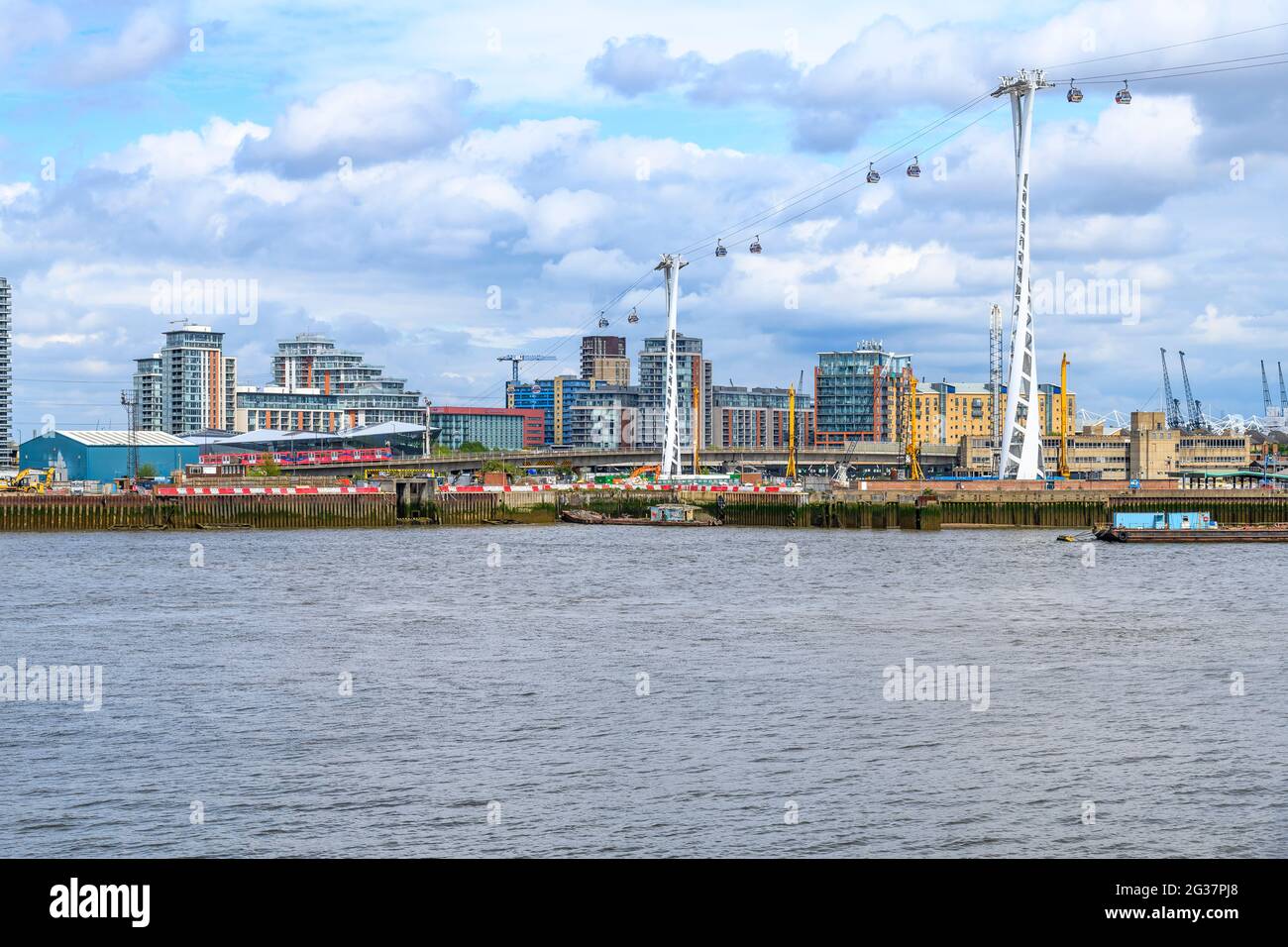 London skyline showing the Emirates Air Line cable car that crosses the ...