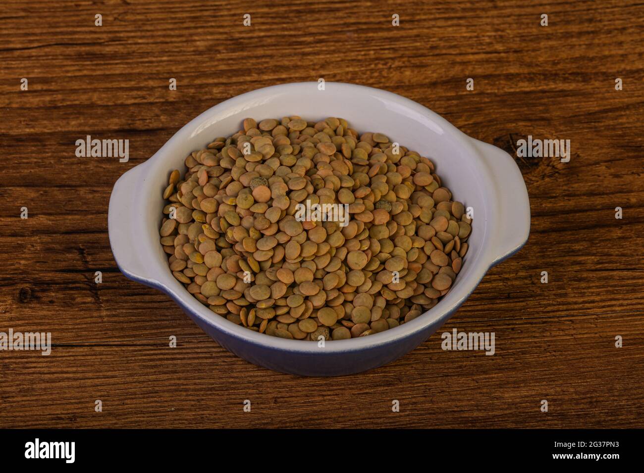 Vegan cuisine - Dry lentil heap isolated Stock Photo - Alamy