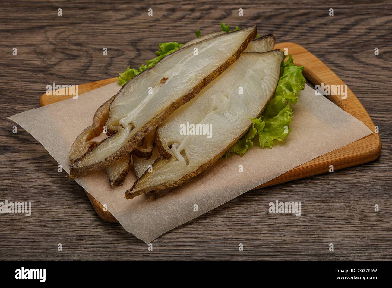 Delicous smoked halibut fish slices snack Stock Photo - Alamy