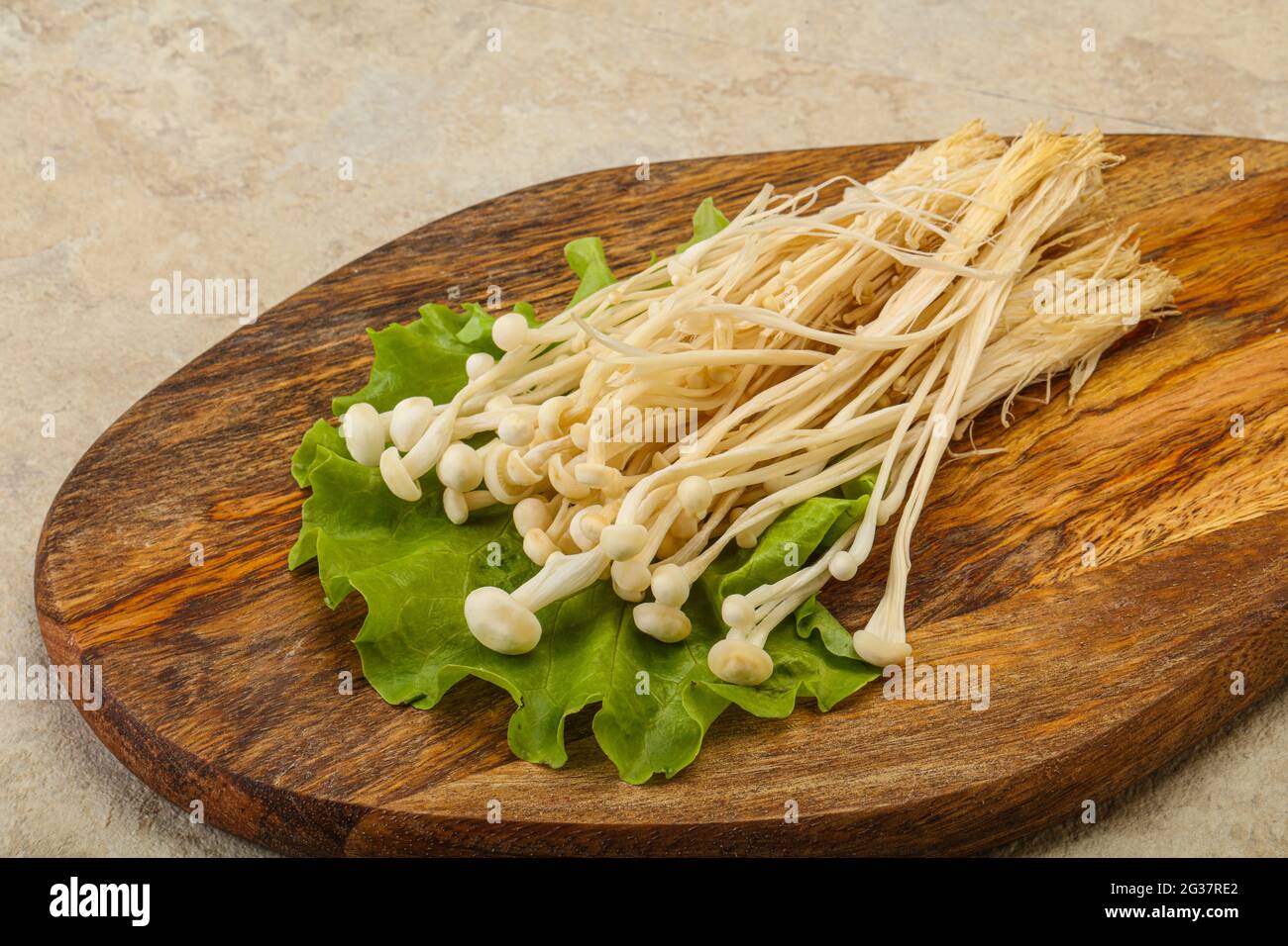 Raw Japanese Enoki mushrooms for cooking Stock Photo - Alamy